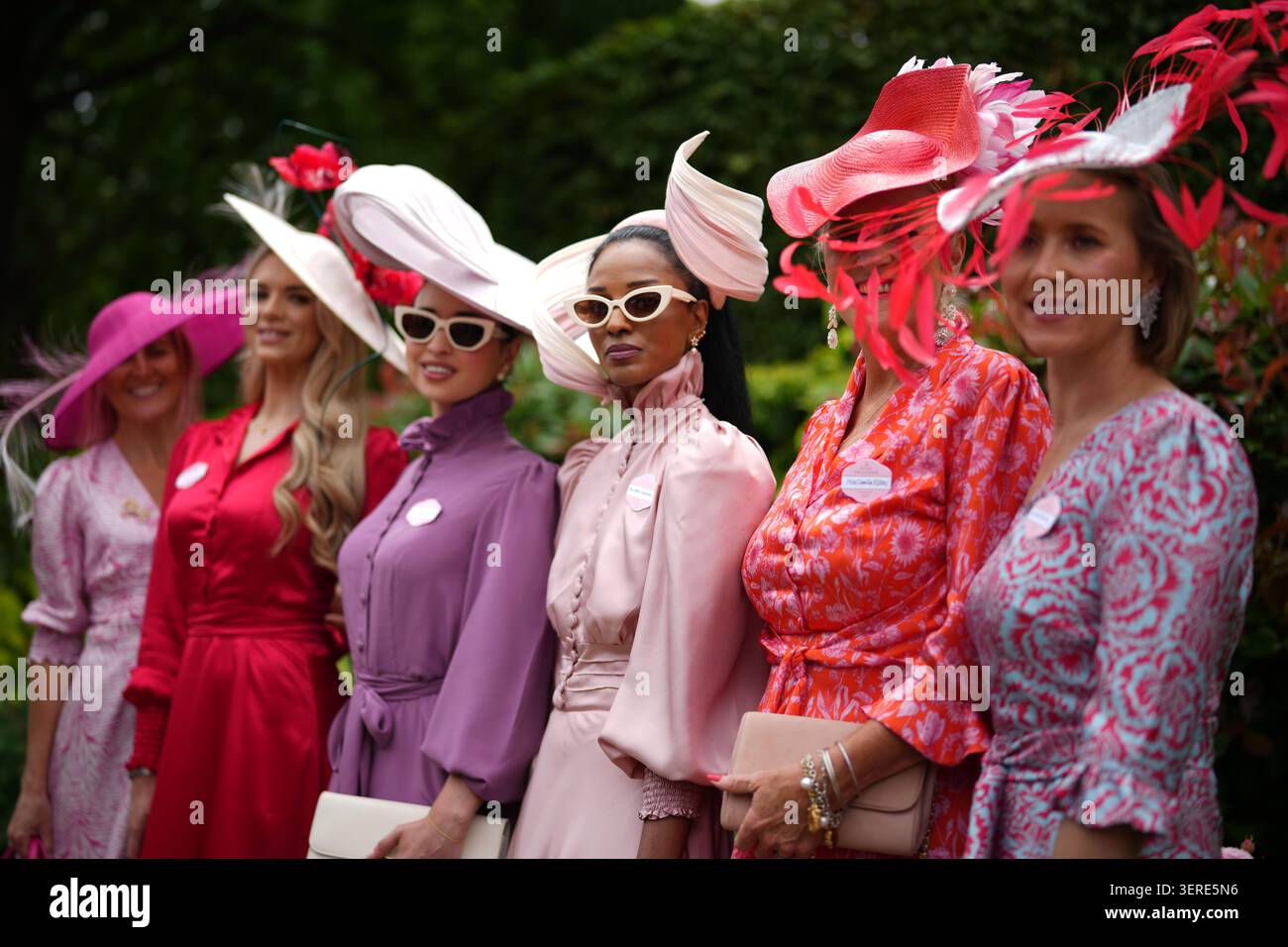 Racegoer Lovely Amusan, third right, poses with friends as they arrive ...