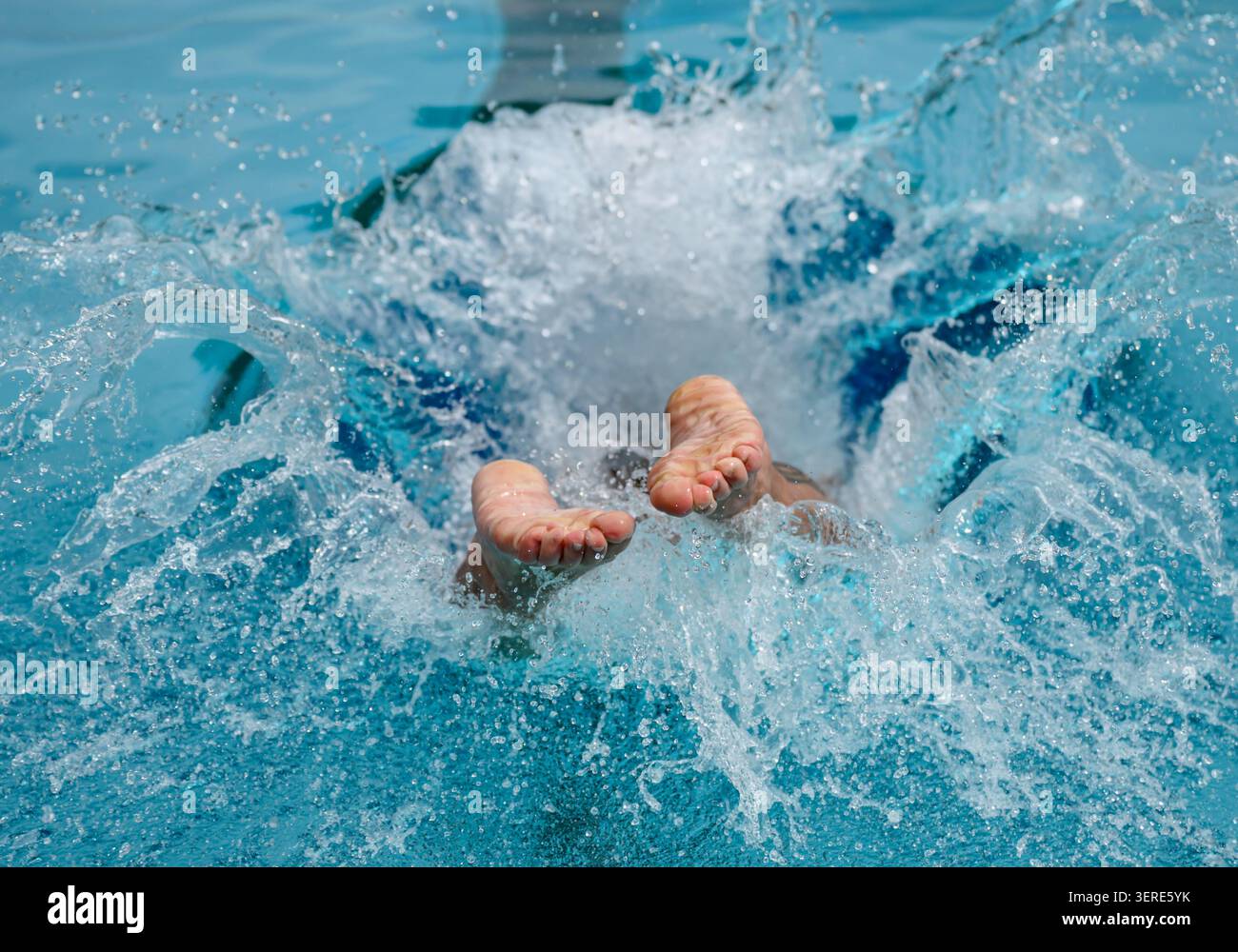 18 June 2026, Brandenburg, Forst/Lausitz: A man jumps into the water at ...