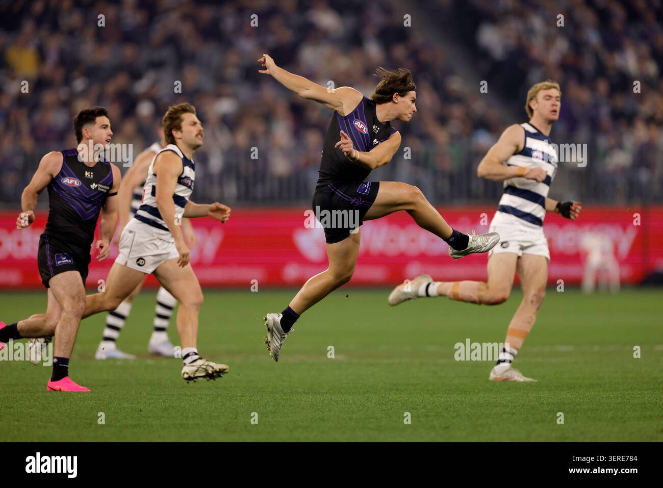 Caleb Serong of the Dockers kicks the ball during the AFL Round 15 ...