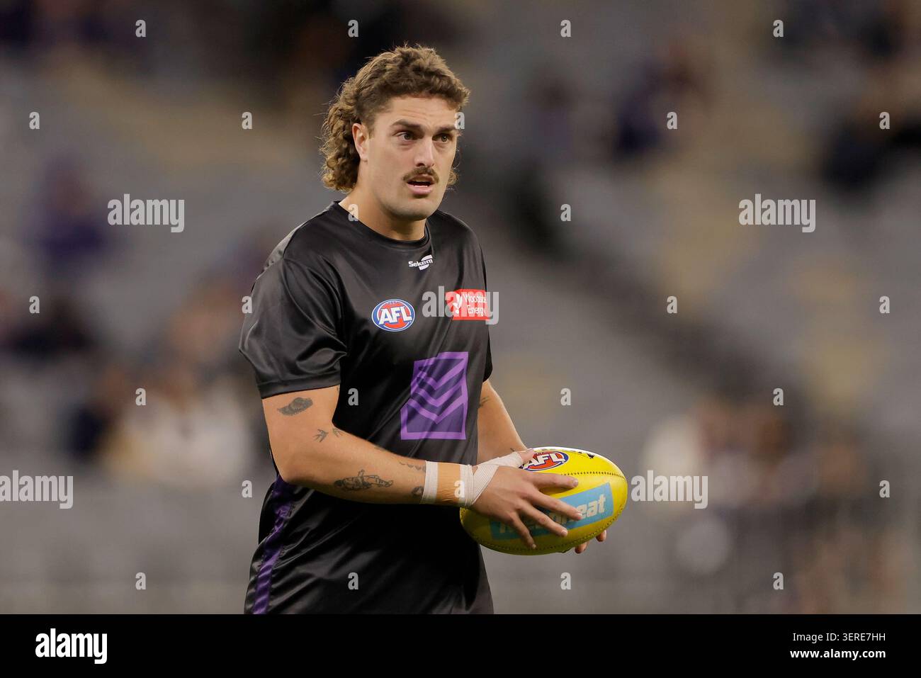 Luke Jackson of the Dockers is seen warming up before the AFL Round 15 ...