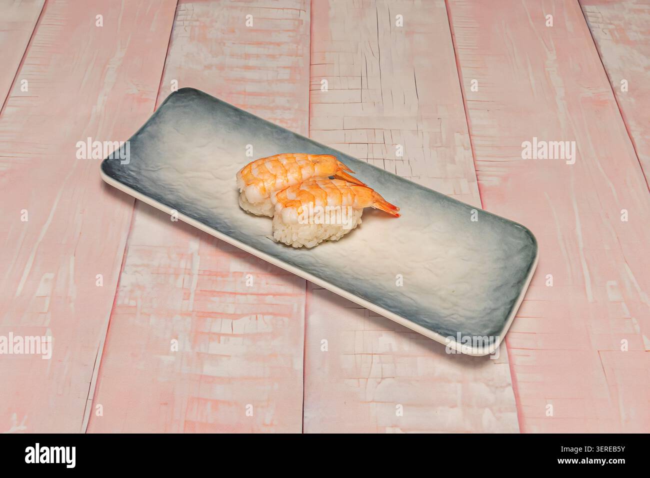 photography captures the reflection of the assorted nigiri on the red ...
