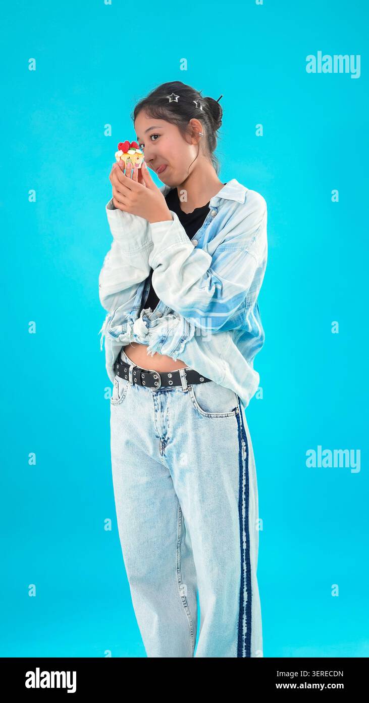 A woman holds her hand to her face in a thoughtful pose Stock Photo - Alamy