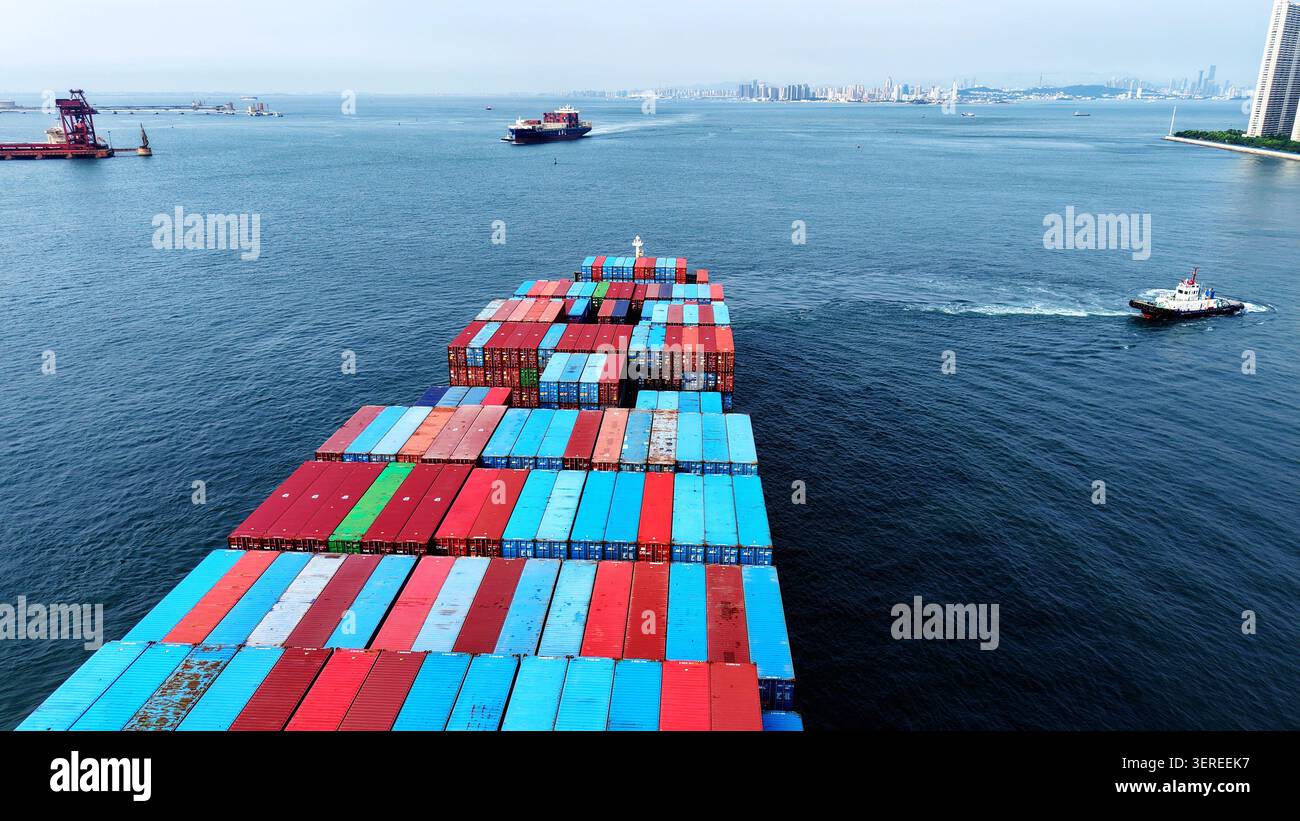QINGDAO, CHINA - JUNE 18, 2026 - A cargo ship loaded with foreign trade ...
