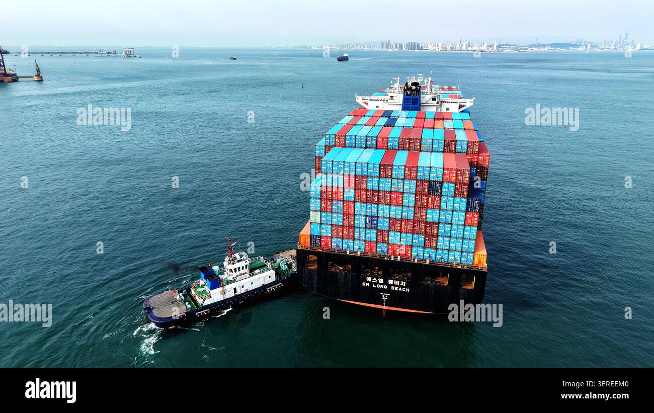 QINGDAO, CHINA - JUNE 18, 2026 - A cargo ship loaded with foreign trade ...