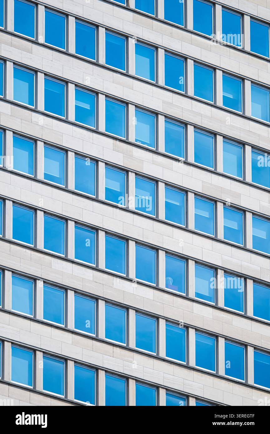 The Sablon Tower office building features a concrete facade punctuated ...