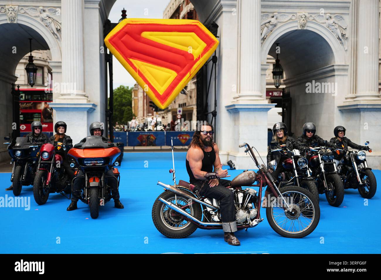 Jason Momoa, front, poses for photographers in front of Marble Arch at ...