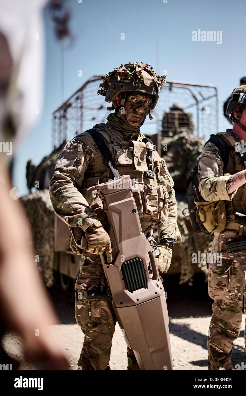 A soldier equipped with a drone-jamming rifle after a demonstration, at ...
