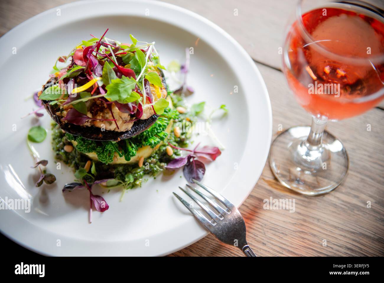 Delicious Gourmet Dish Served With a Vibrant Cocktail on a Wooden Table ...
