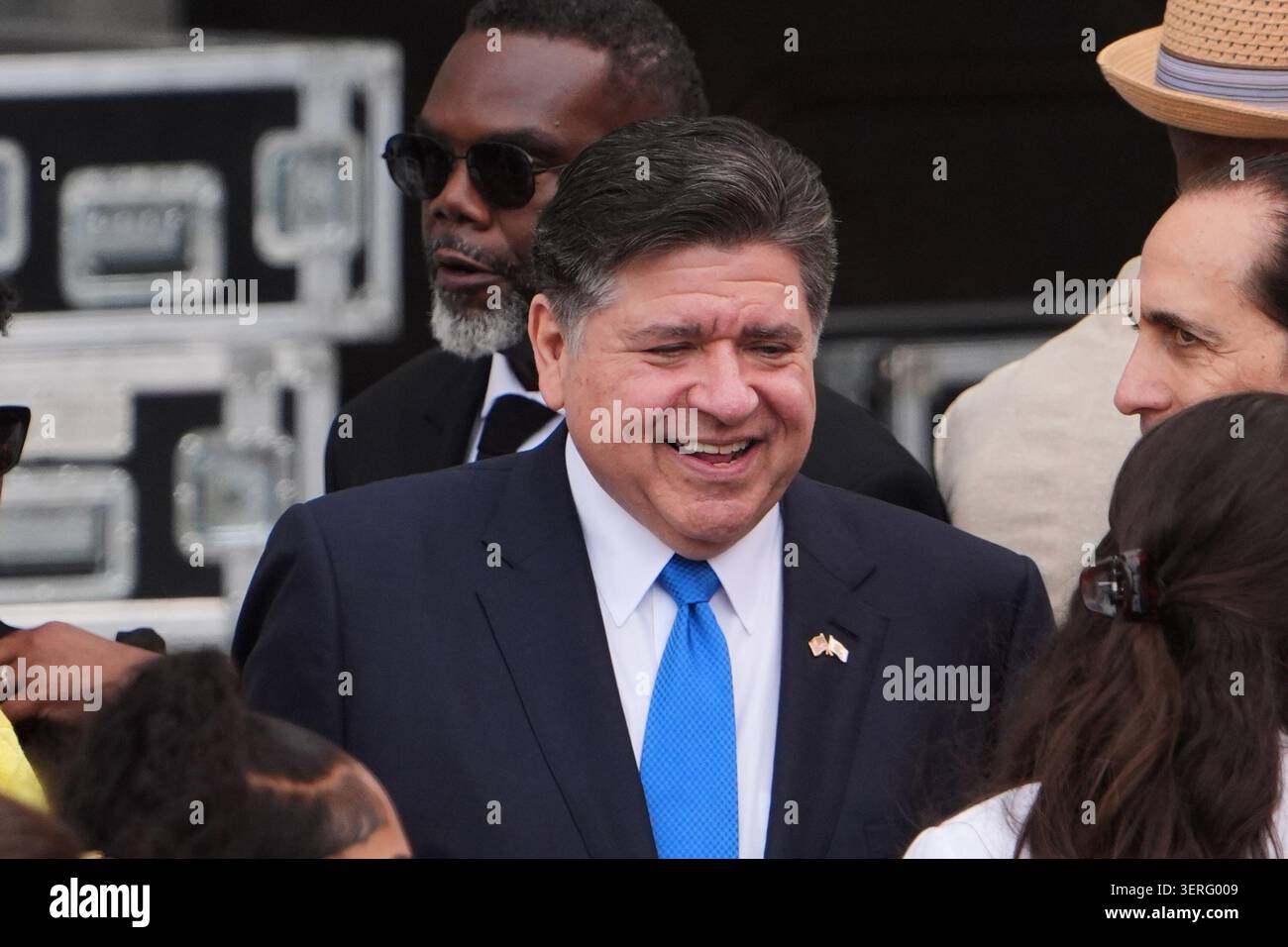 Illinois Gov. J.B. Pritzker, center, mingles ahead of the Obama ...