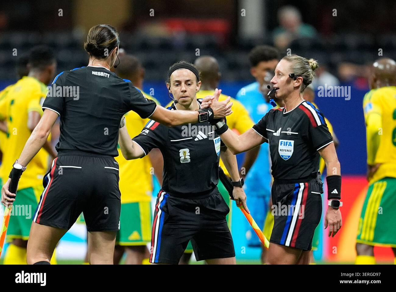 Referee Tori Penso, right, shakes hands with assistant referees Kathryn ...