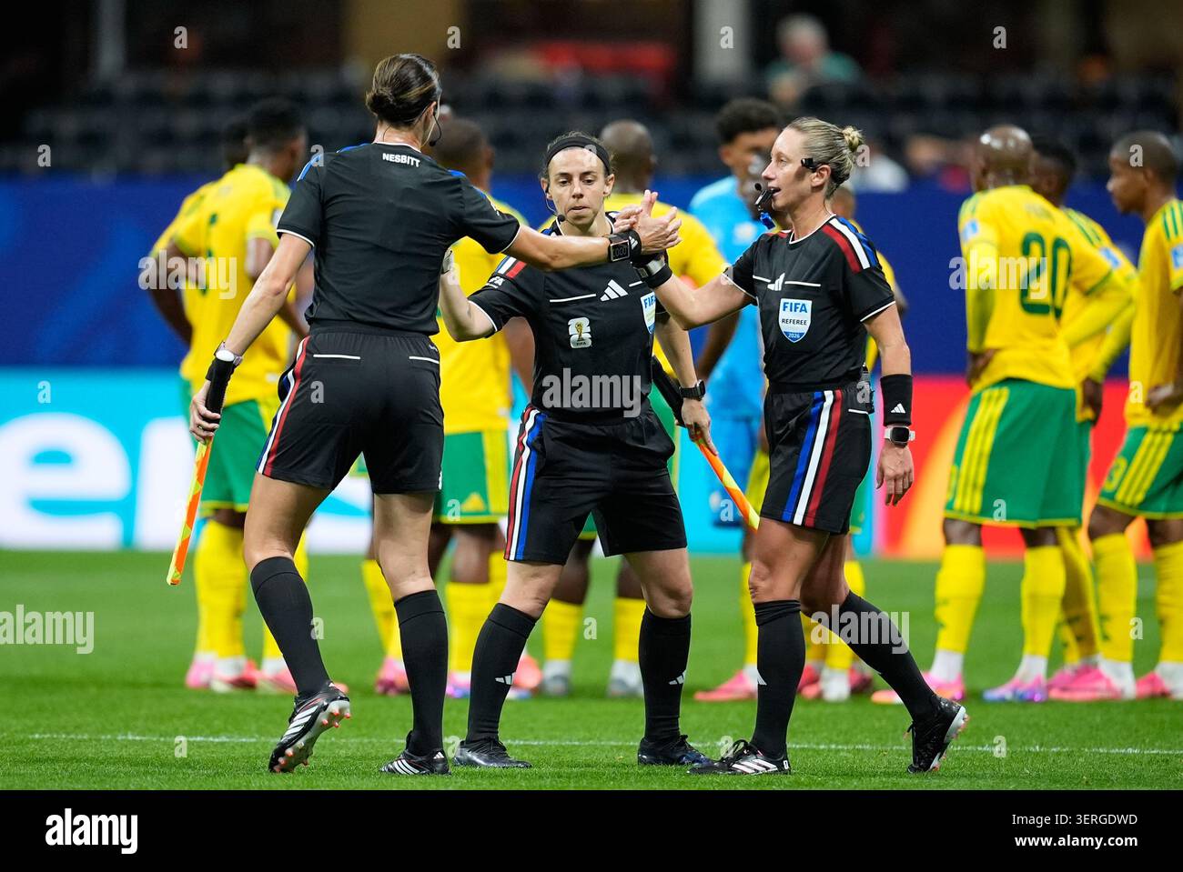 Referee Tori Penso, right, shakes hands with assistant referees Kathryn ...