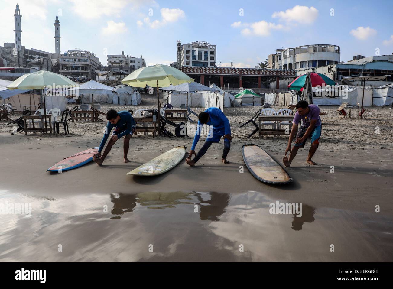 Palestinians practice surfing in the sea off Gaza City on June 16, 2026 ...
