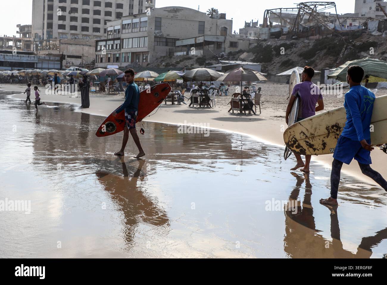 Palestinians practice surfing in the sea off Gaza City on June 16, 2026 ...
