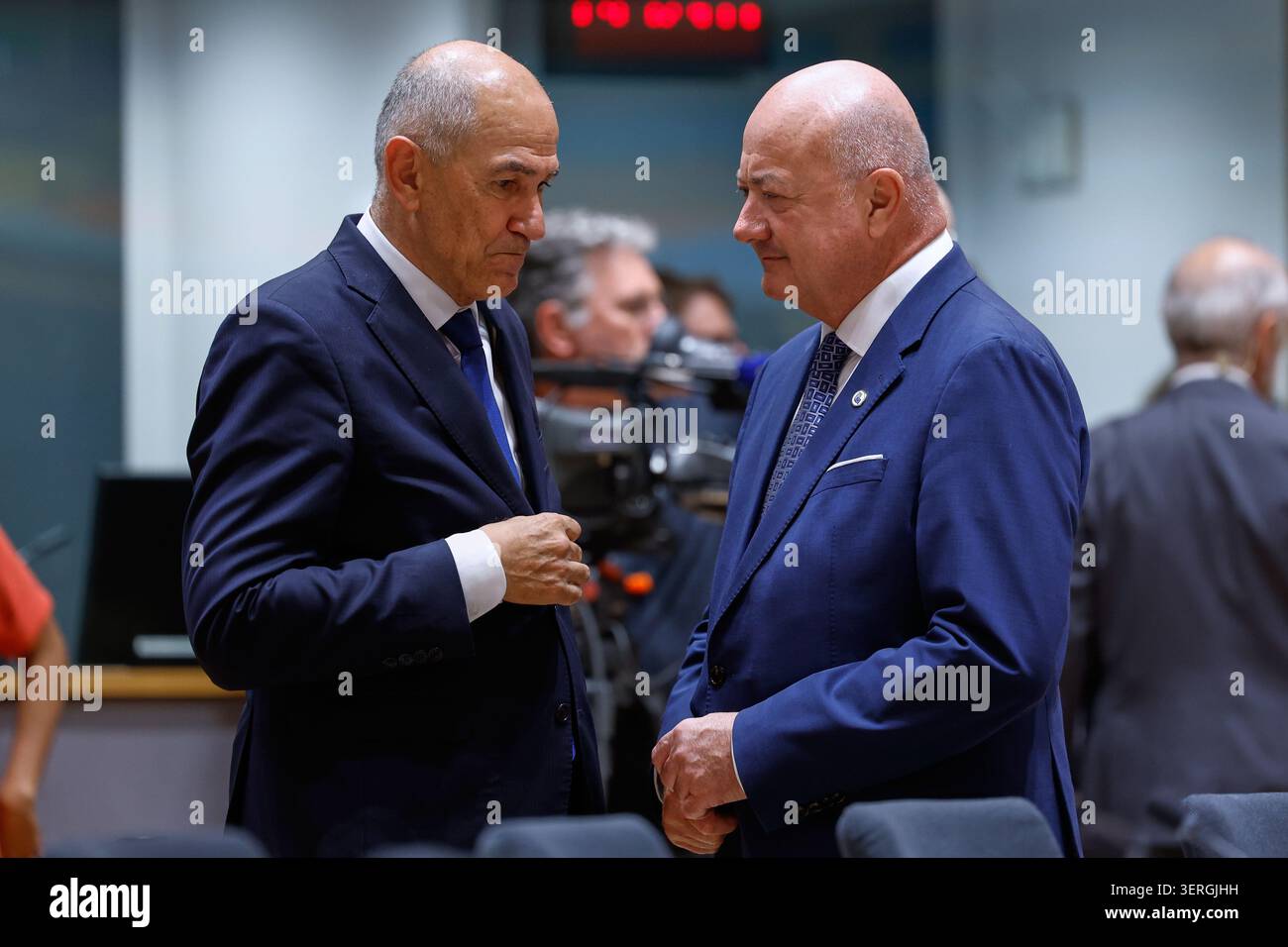 Slovenia's Prime Minister Janez Jansa, left, talks to Austria's ...
