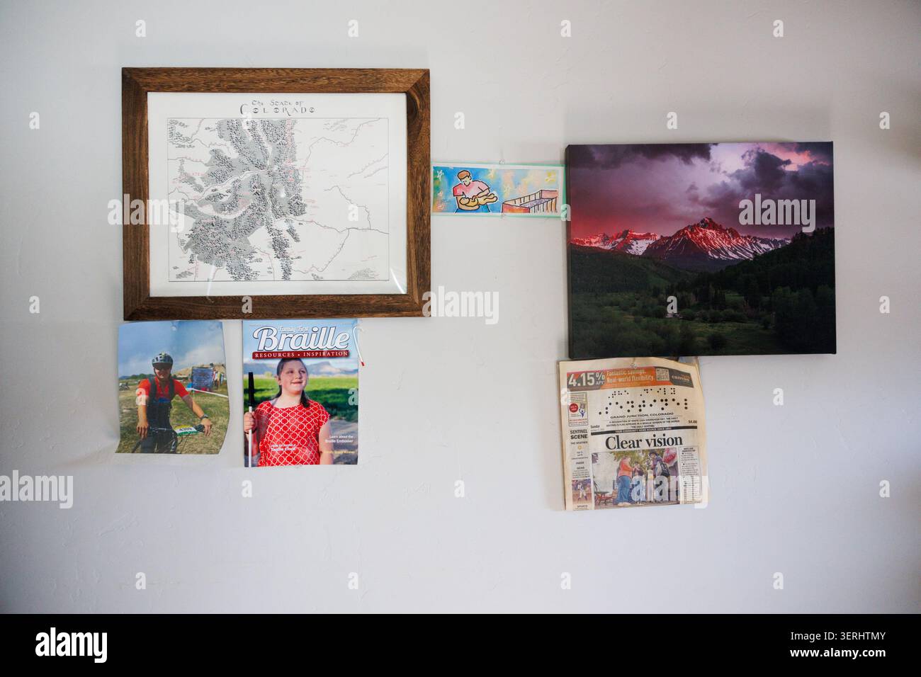 Newspaper clippings featuring Isabelle Harris are pinned to the wall of ...