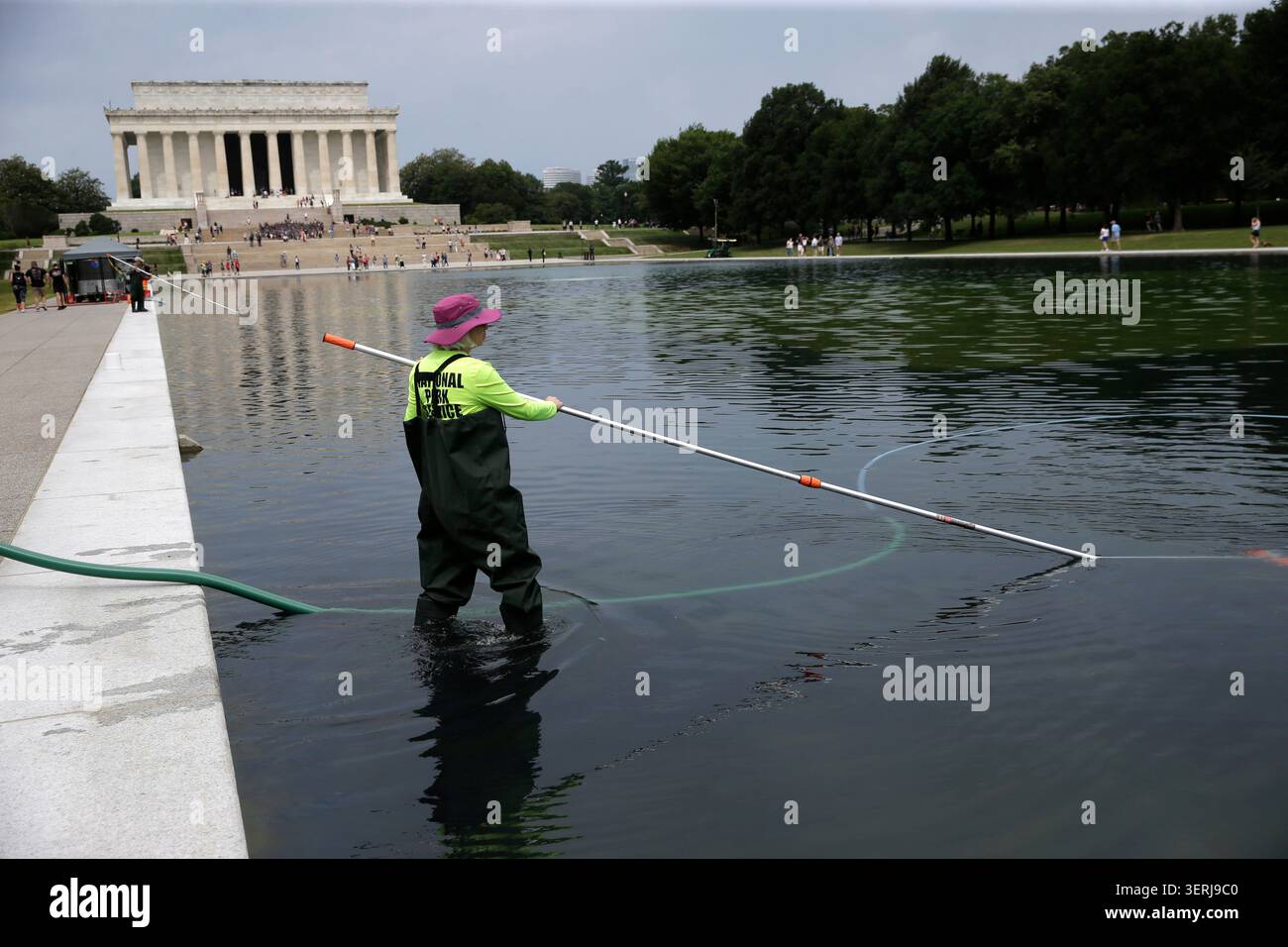 Members of the National Park Service clean algae from the Lincoln ...
