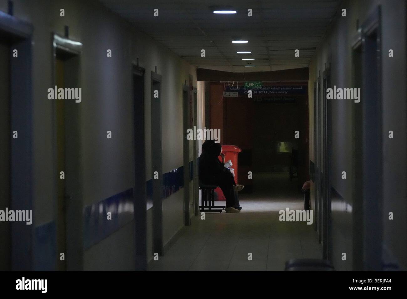 Women wait in a corridor at Jabal Amel Hospital, which was heavily ...
