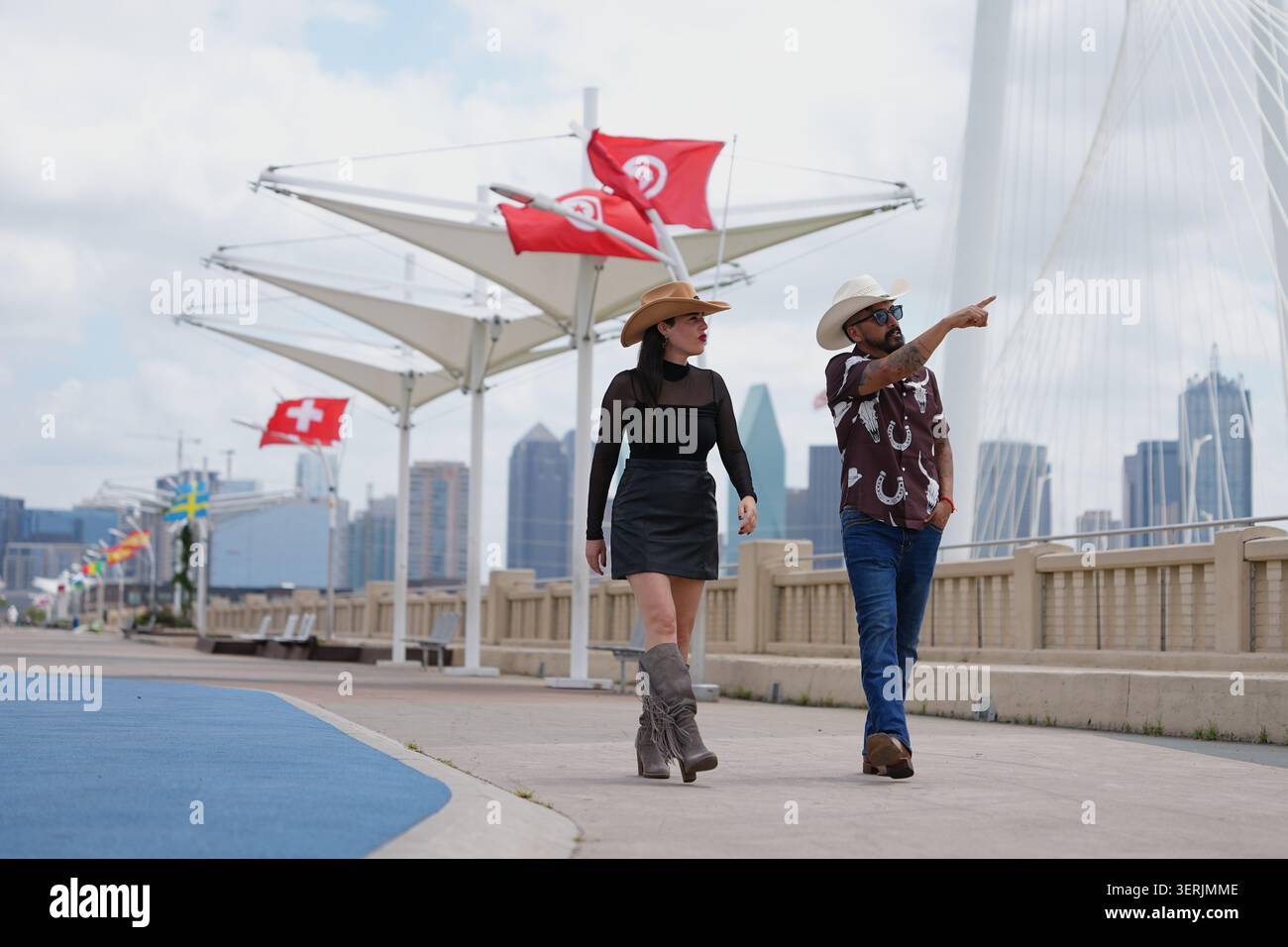 Amelyza Martinez, left, and Juanfher Garzia walk on the Ronald Kirk ...