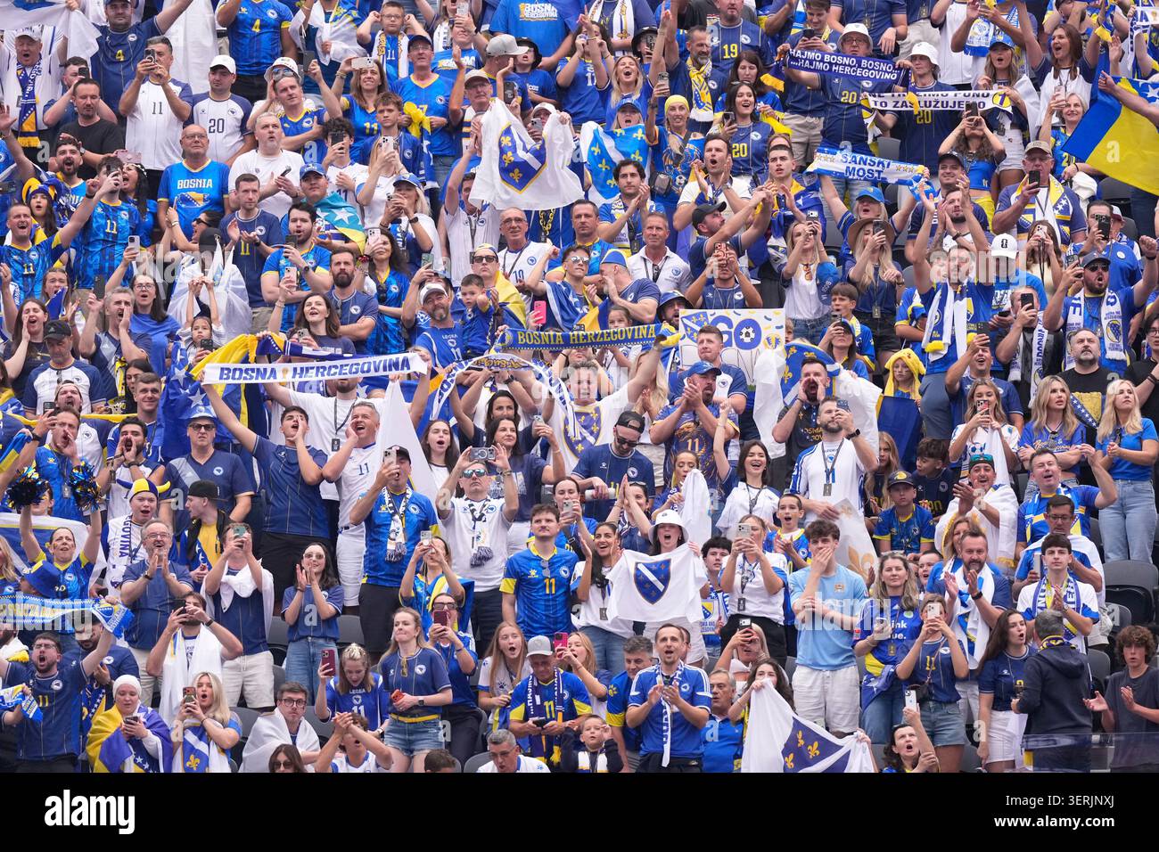 Bosnia's fans cheer prior to a World Cup Group B soccer match between ...