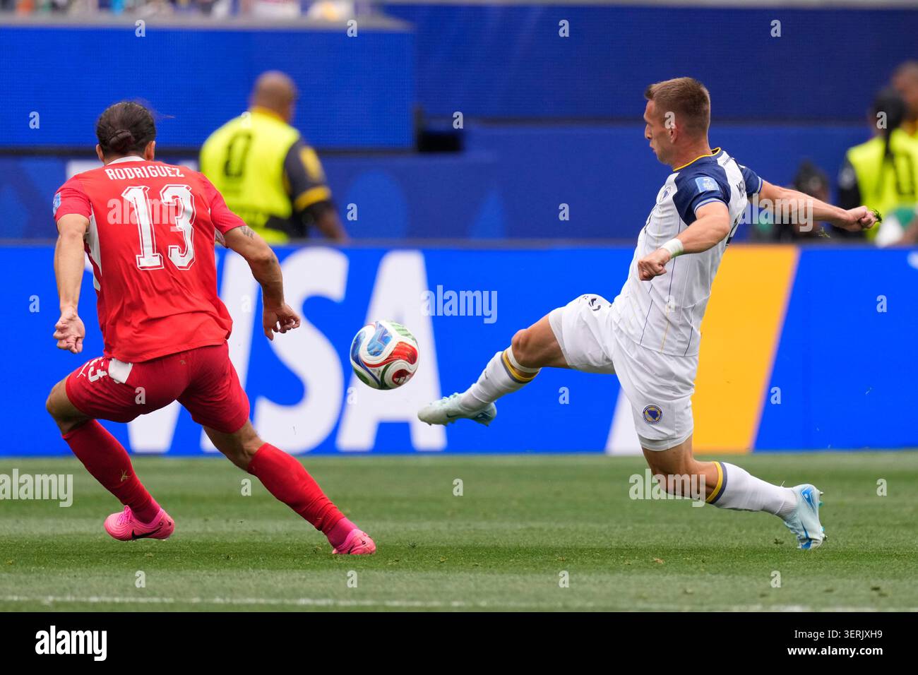 Bosnia's Amar Memic, right, is challenged by Switzerland's Ricardo ...