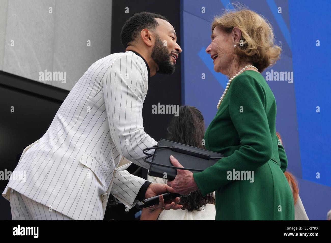 Artist John Legend greeting former first lady Laura Bush during the ...