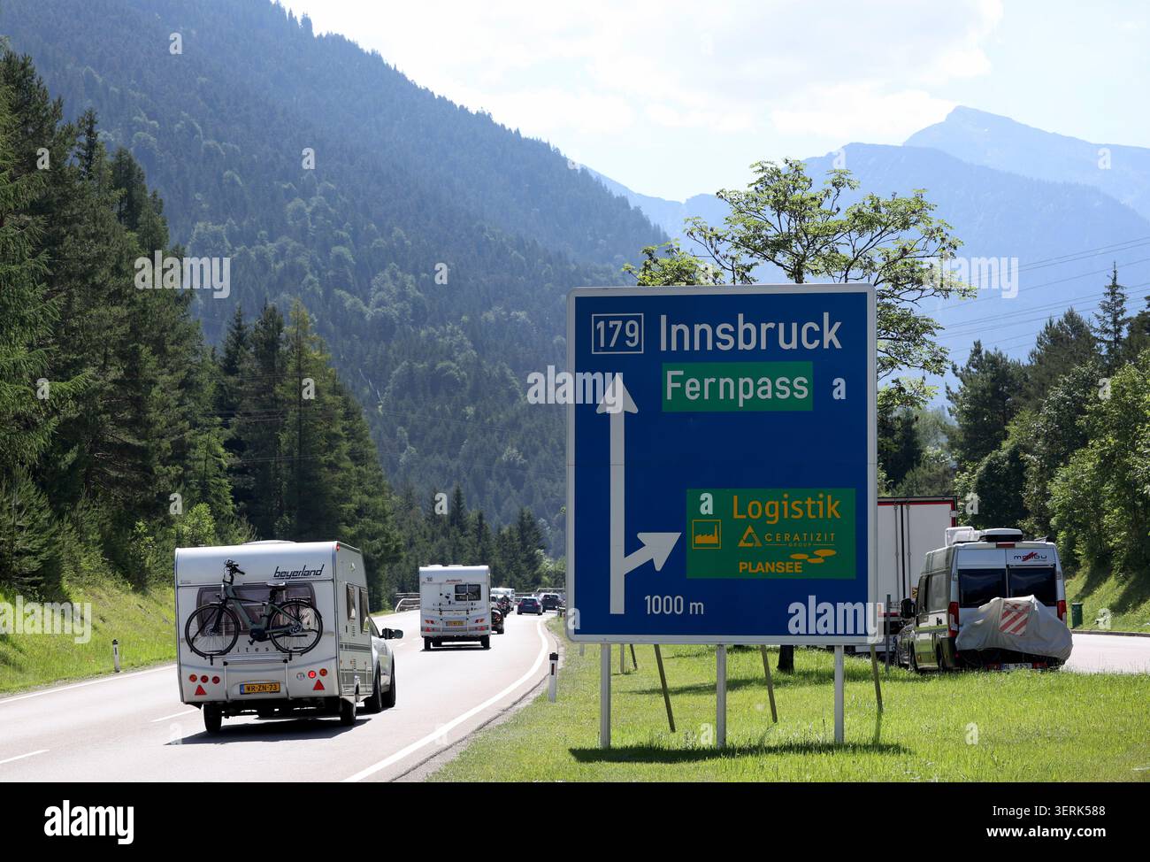 PRODUCTION - 18 June 2026, Austria, Reutte: RV drivers pass a sign on ...