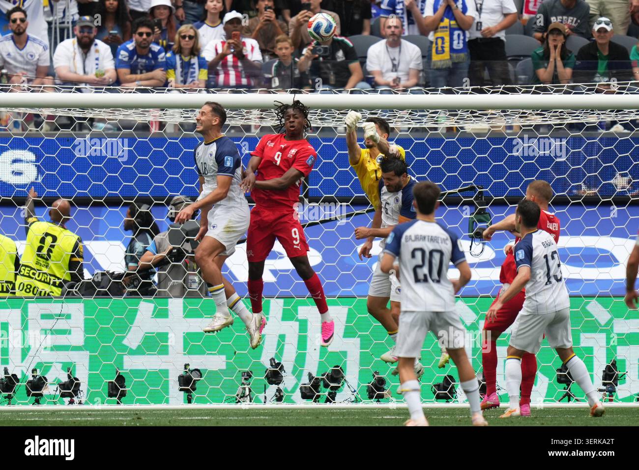 Bosnia's Nikola Katic, left, and Switzerland's Johan Manzambi (9) jump ...