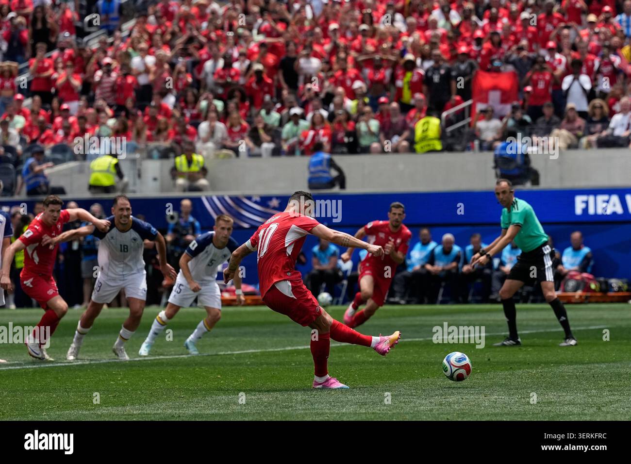 Switzerland's Granit Xhaka (10) scores on a penalty kick during the ...