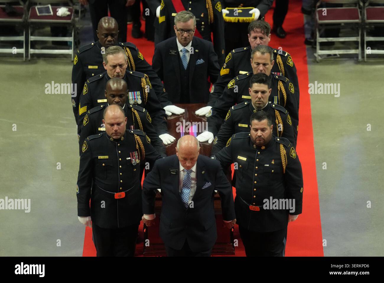 The casket is moved by police officers during funeral service for OPP ...