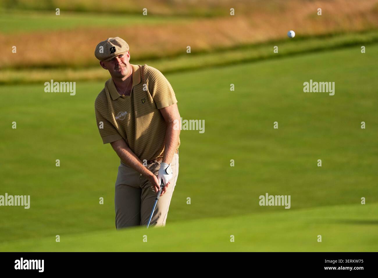 Harry Hall, of England, chips to the green on the 11th hole during the ...