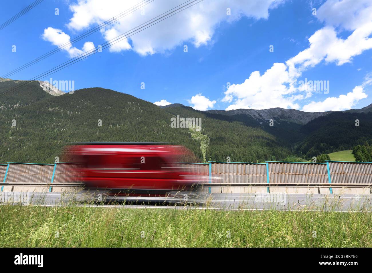 PRODUCTION - 18 June 2026, Austria, Bichlbach: A car drives past a ...