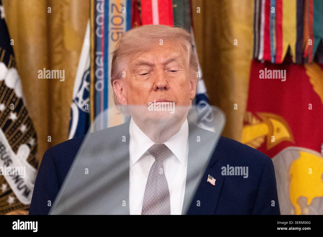 A teleprompter lowers in front of United States President Donald J ...