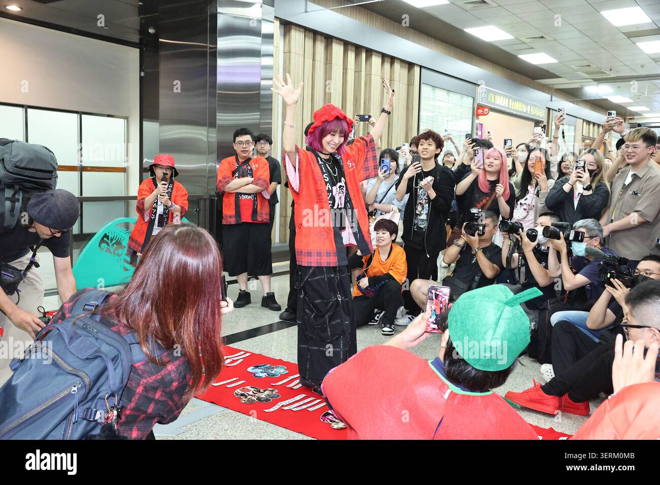 TAIPEI, CHINA - JUNE 18, 2026 - Fans welcome Japanese rock singer LiSA ...