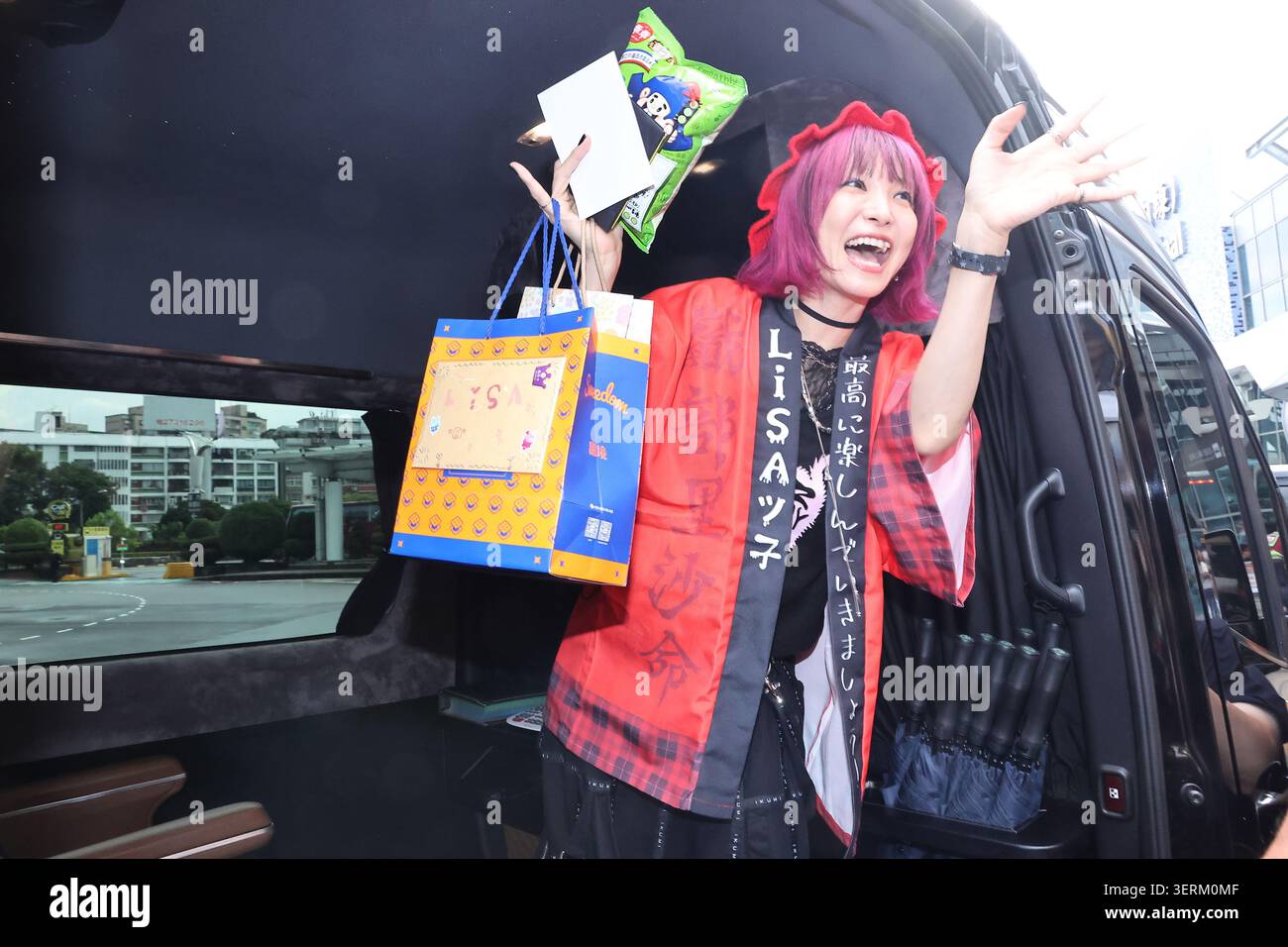 TAIPEI, CHINA - JUNE 18, 2026 - Fans welcome Japanese rock singer LiSA ...