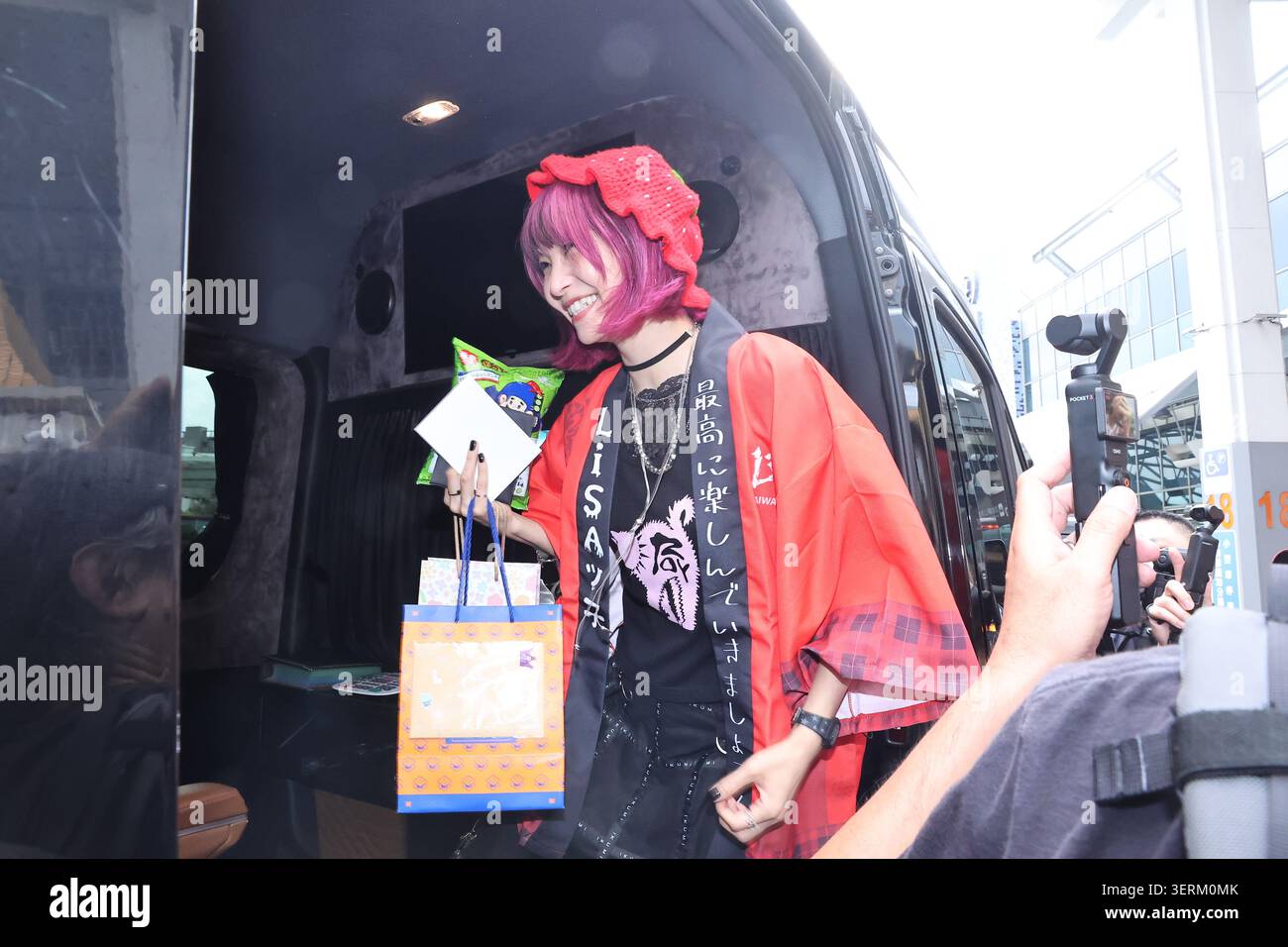 TAIPEI, CHINA - JUNE 18, 2026 - Fans welcome Japanese rock singer LiSA ...