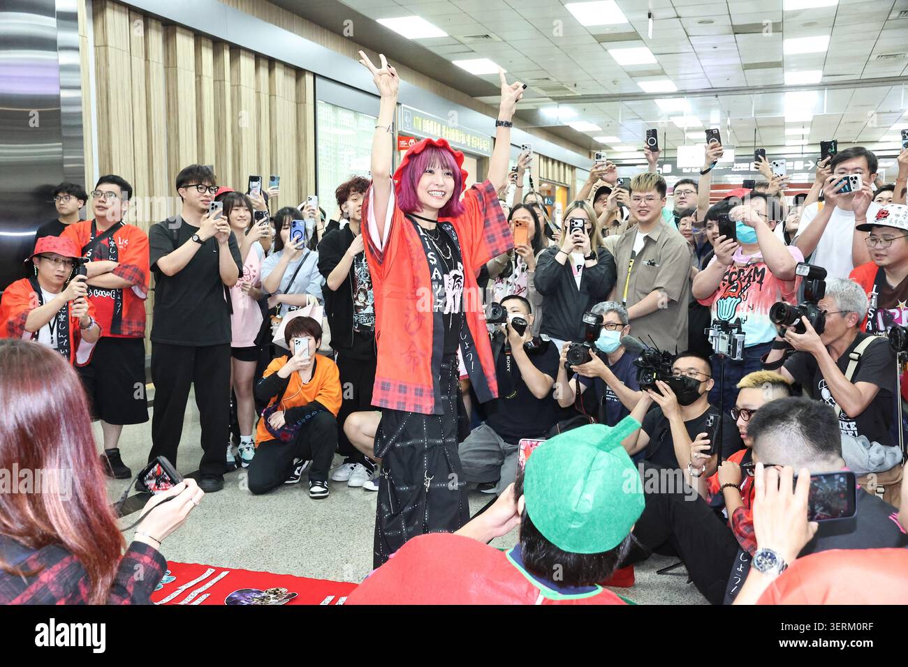TAIPEI, CHINA - JUNE 18, 2026 - Fans welcome Japanese rock singer LiSA ...