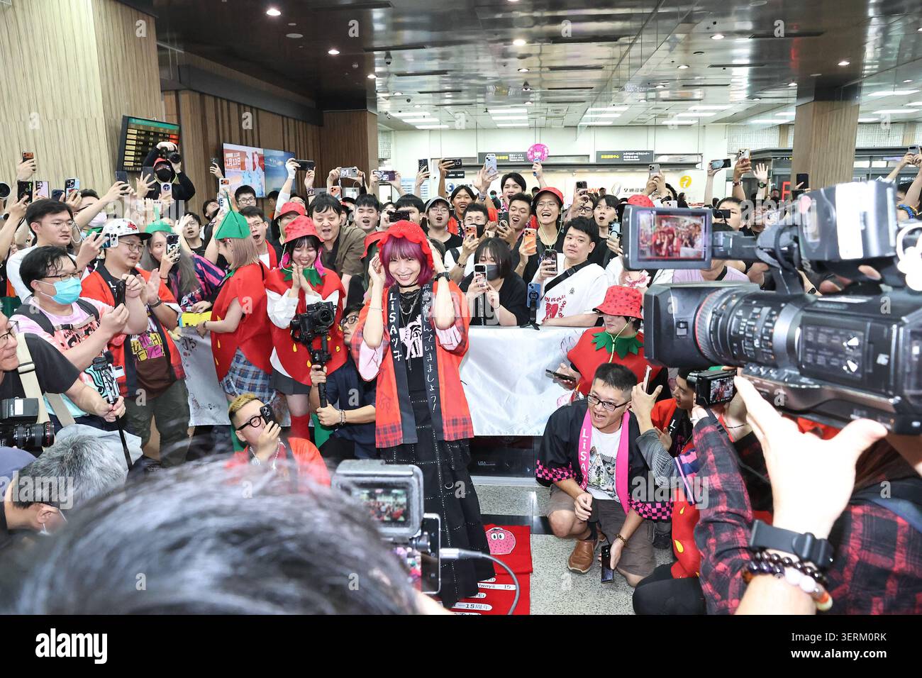 TAIPEI, CHINA - JUNE 18, 2026 - Fans welcome Japanese rock singer LiSA ...