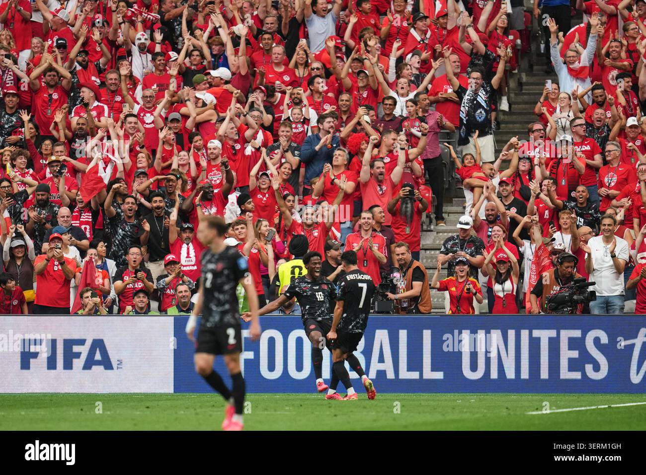 Canada's Jonathan David, center, celebrates with Stephen Eustaquio ...