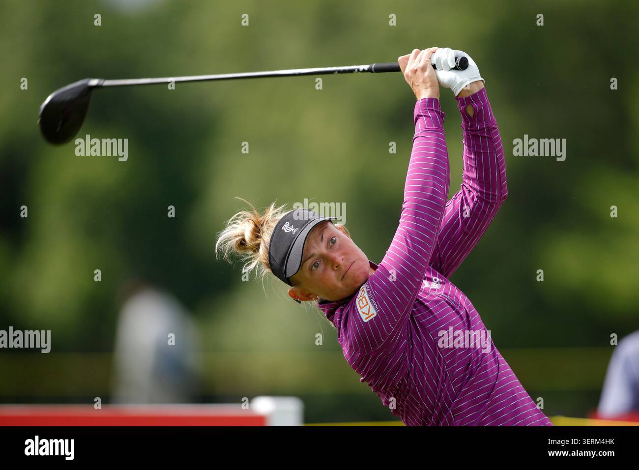 Jessica Porvasnik watches her tee shot on the ninth hole during the ...