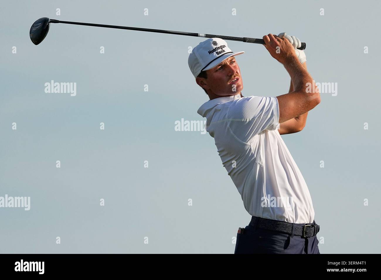 Preston Stout watches his tee shot on the 11th hole during the first ...