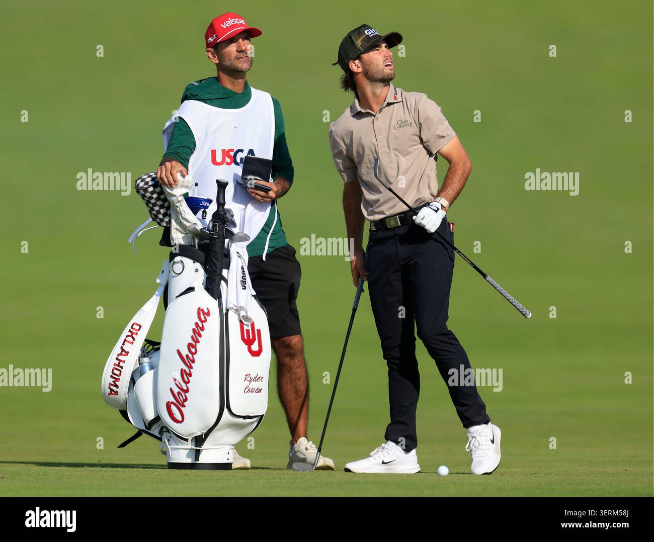 Amateur Ryder Cowan talks with his caddie on the 1st fairway during the ...