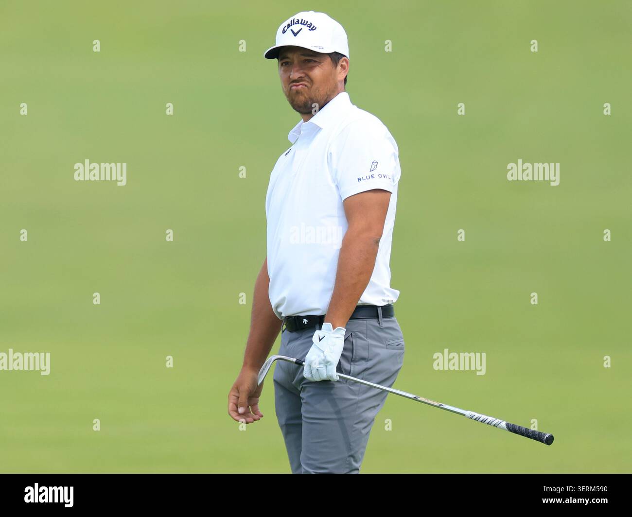 Xander Schauffele prepares to hit an approach shot on the 1st fairway ...