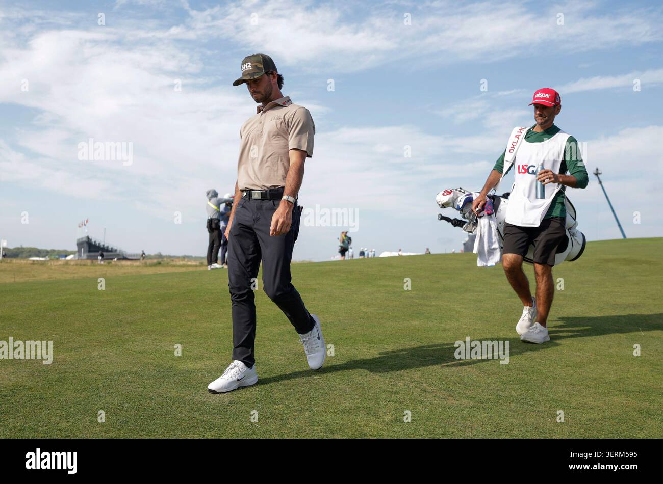 Amateur Ryder Cowan walk off the green on the 1st hole during the first ...