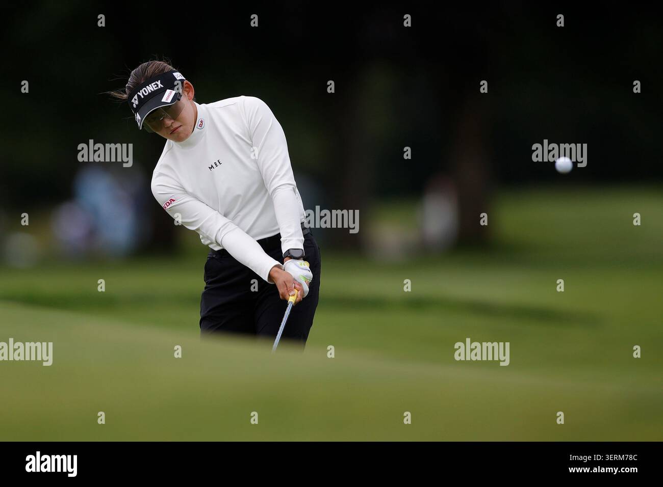 Chizzy Iwai, of Japan, hits onto the eighth hole during the first round ...