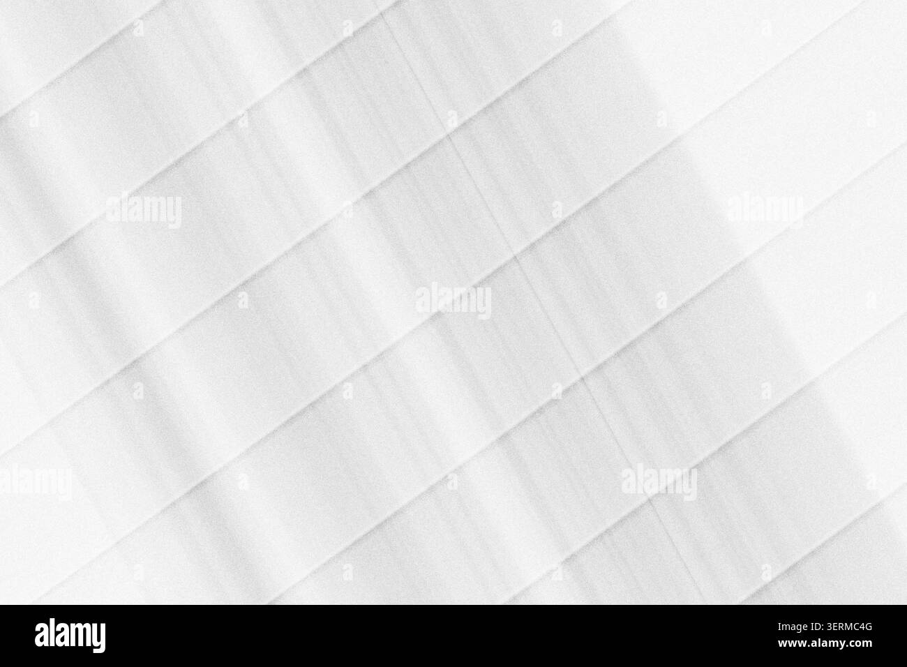A high-contrast monochrome abstract background featuring diagonal ...