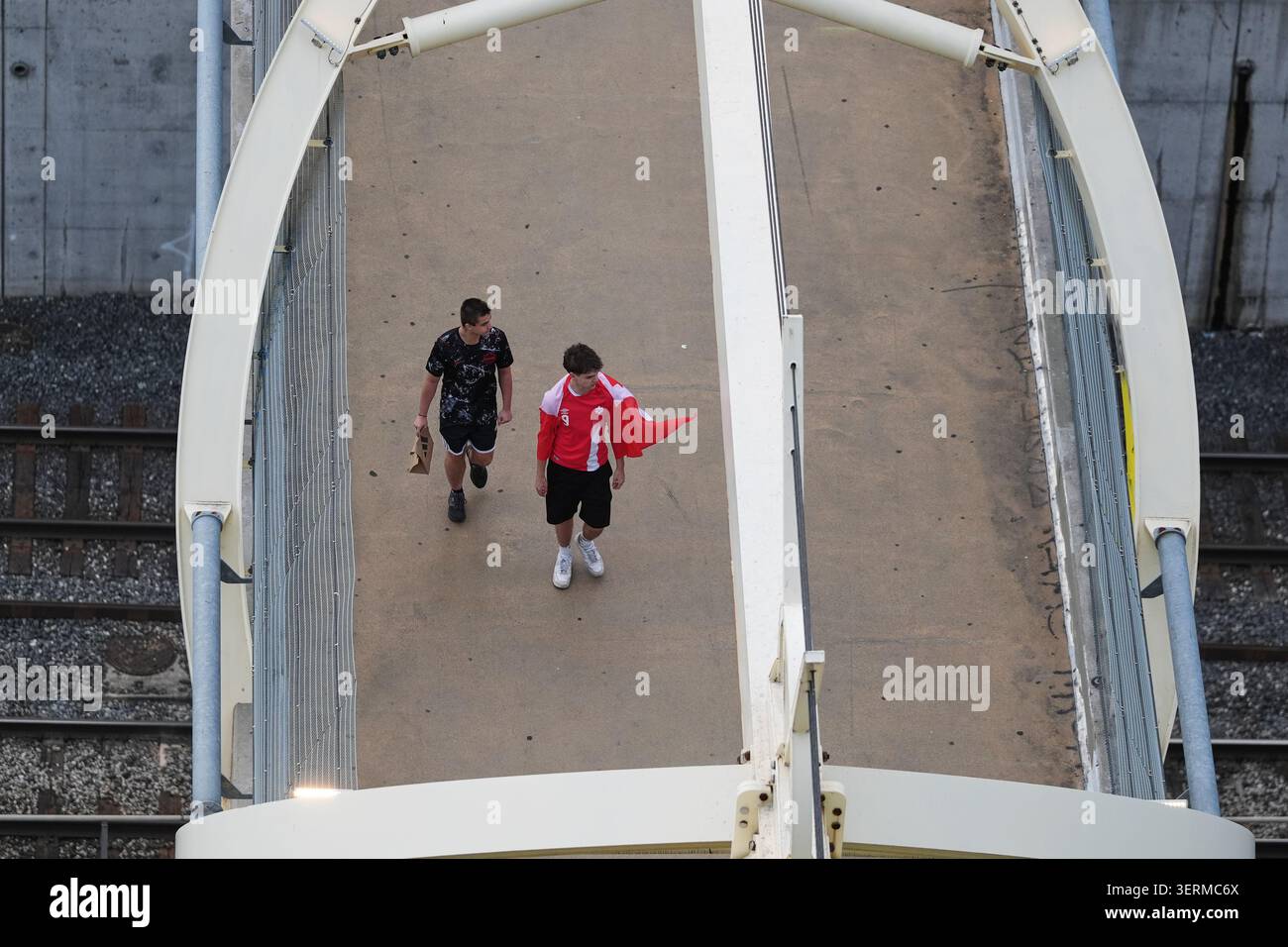 Fans wear Canada jerseys while crossing a bridge following Canada's ...
