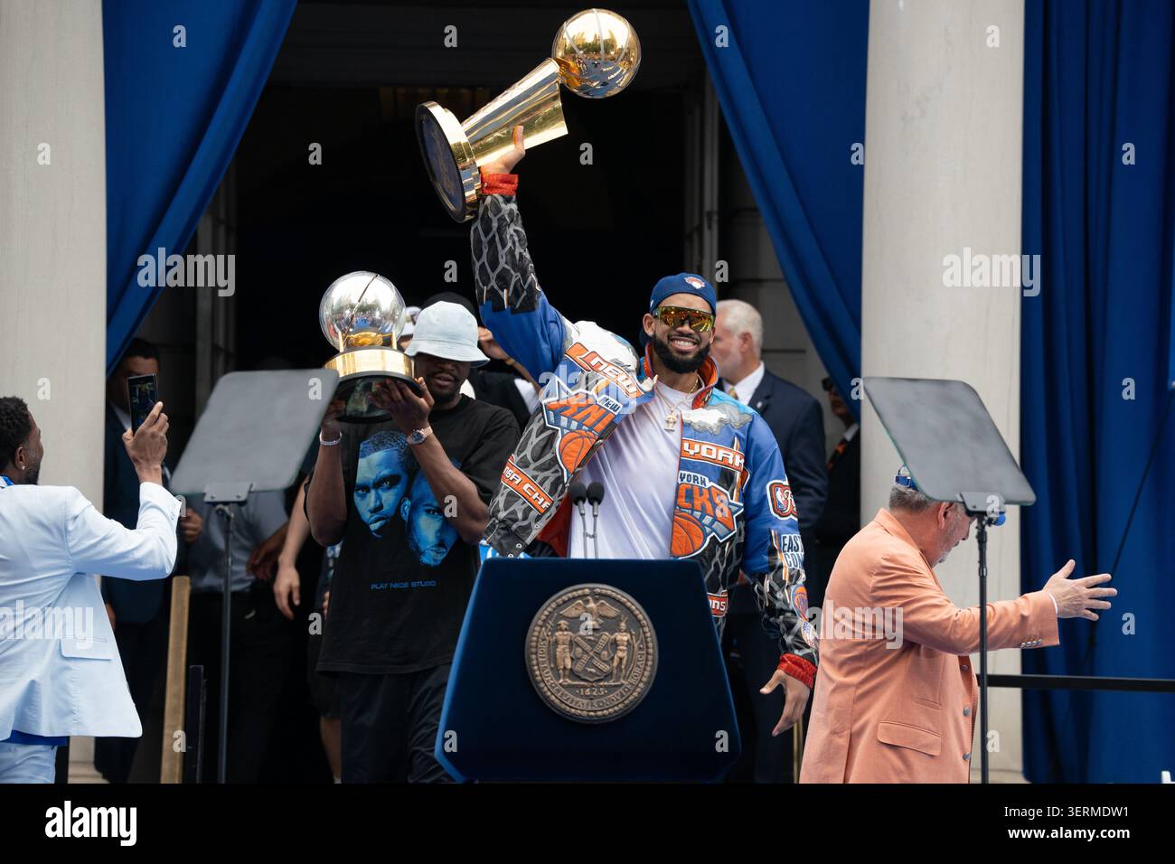Karl-Anthony Towns raises the Larry O'Brien trophy during the 2026 NBA ...