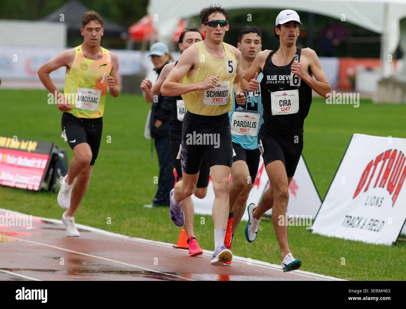 Adam Schmidt, front left, and Cameron Cira, right, compete in the ...