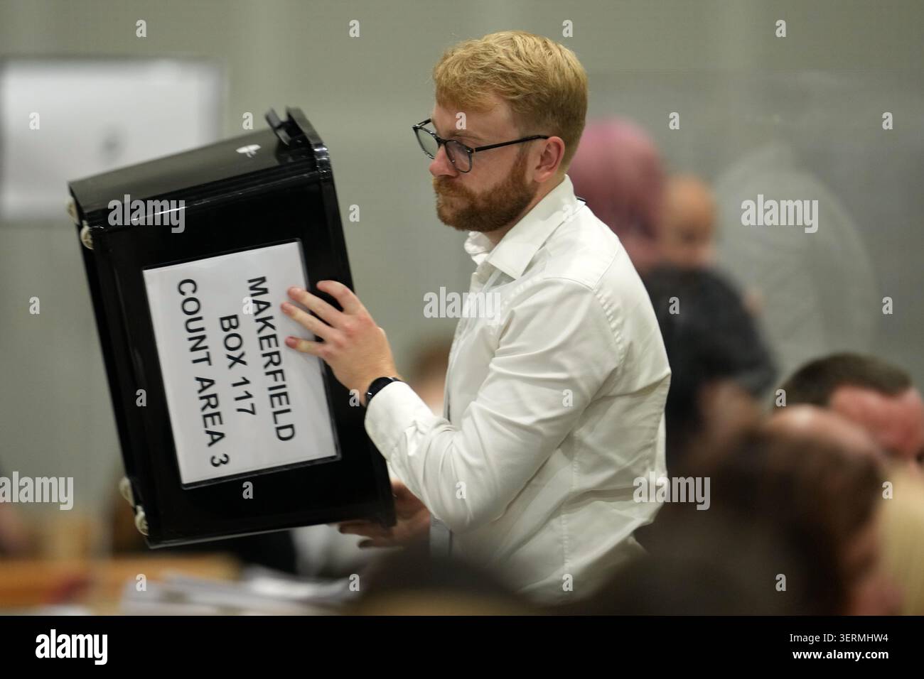 A ballot box is emptied as vote counts starts after the Makerfield by ...
