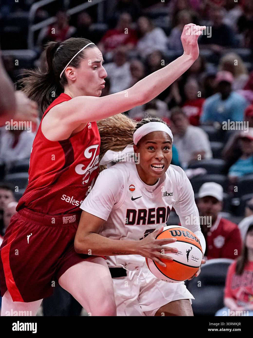 Atlanta Dream guard Jordin Canada, right, drives under Indiana Fever ...